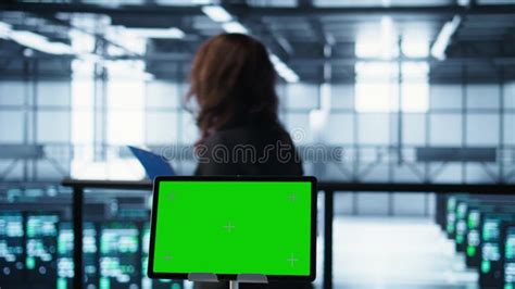 Close Up Of Chroma Key Tablet And Teamworking Programmers In Server