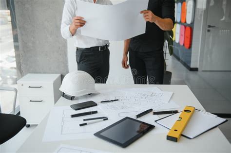 Engineer Or Architect Teamwork Working On Construction Project With Building Model And Blueprint