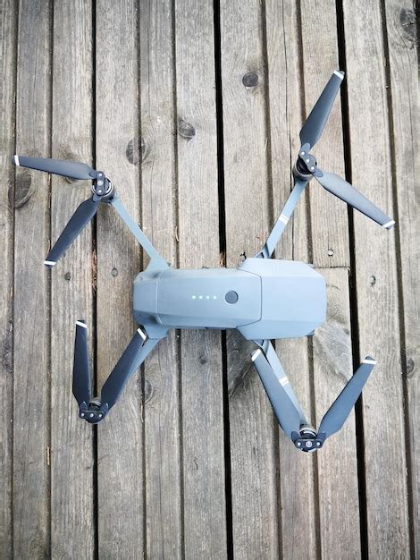 Premium Photo High Angle View Of Quadcopter On Wooden Table