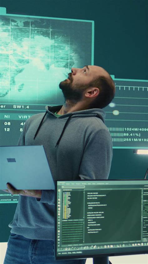 Vertical Cyber Defense Expert Examining Data On A Big Screen In