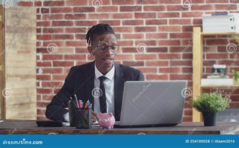 Black Office Corporate Man In Glasses And An Official Suit Gesturing