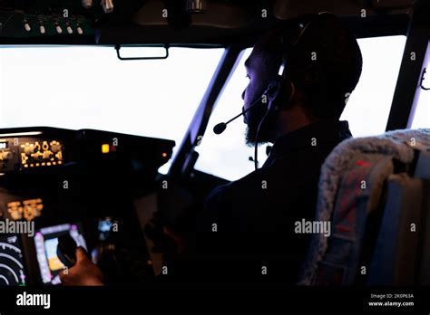African American Copilot Holding Lever To Takeoff With Airplane Flying Aircraft With Dashboard
