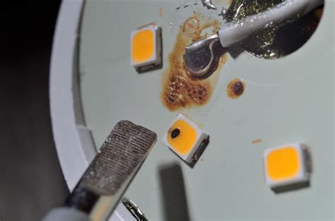 Premium Photo A Burned Out Led In An Energy Saving Lamp Close Up