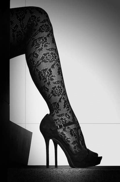 Premium Photo Low Section Of Woman Wearing Fishnet Stockings And High