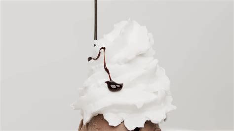 Close Up Chocolate Sauce Below The Layers Of Whipped Cream Whipped Cream On Ice Cream On The