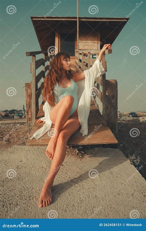 Vertical Shot Of A Brunette Female Model Posing At A Beach In Cyprus