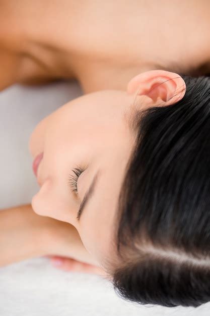 Premium Photo Pretty Brunette Enjoying A Massage At Camera