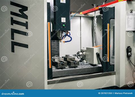Metalworking Cnc Lathe Milling Machine With Coolant Milling Apiece Of Aluminium Editorial Image