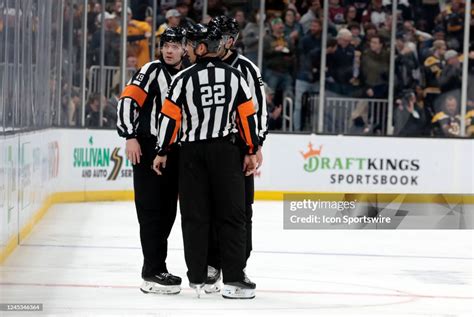 Referees Ghislain Hebert And Reid Anderson Discuss A Goal Disallowed