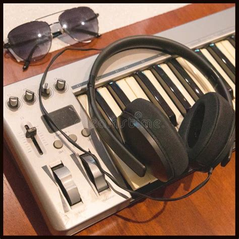 Midi Music Keyboard Synth With Pitch Bender Wheels Headphones Sunglasses And Black Border Stock
