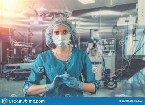 Attractive Female Doctor Holding Syringe In Operating Room For Patient Stock Image Image Of
