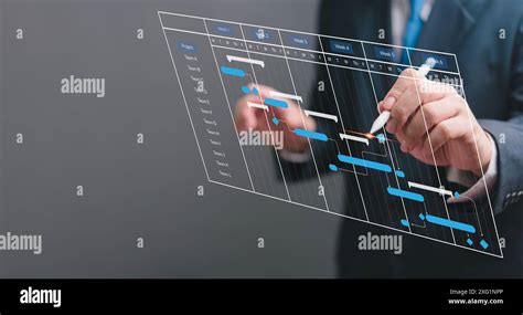 Businessperson Managing Project Schedule With Digital Gantt Chart