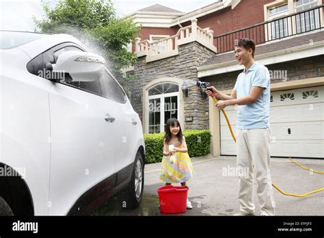 Girl Helping Father Cleaning Car Stock Photo Alamy