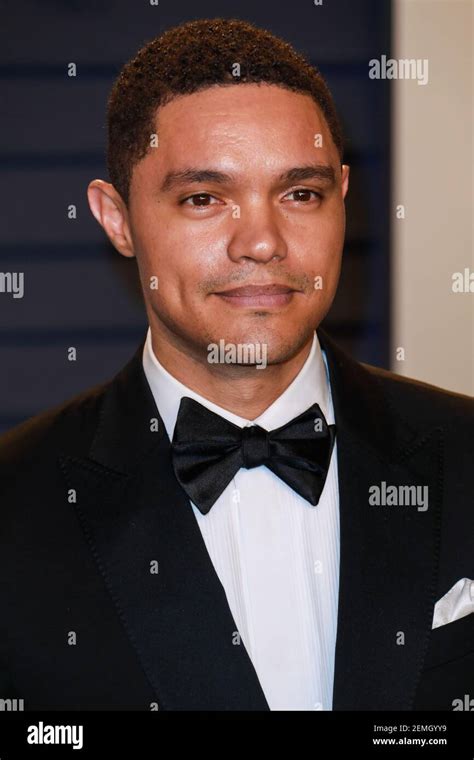 Trevor Noah Walking On The Red Carpet At The 2019 Vanity Fair Oscar Party Held At The Wallis
