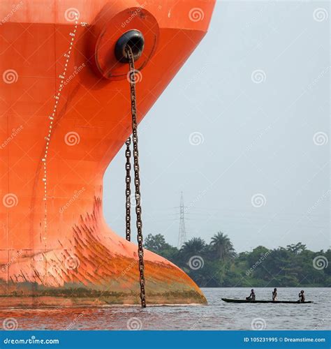Prow Of A Big Ship Face To Face With A Small Wooden Pirogue Editorial Image Image Of Face