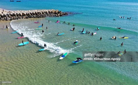 This Aerial Photo Shows Tourists Going Surfing At Riyue Bay In News