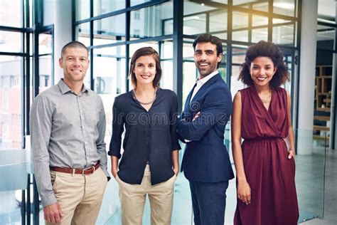 We Believe In The Value Of Teamwork Portrait Of A Team Of Confident Professionals Standing