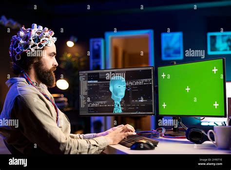 Software Engineer With Eeg Headset Starting Mind Upload On Green Screen Pc Trying To Gain