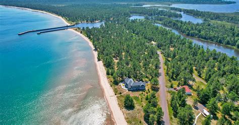 This Lake Beach With Caribbean Blue Water In Michigan Will Make You