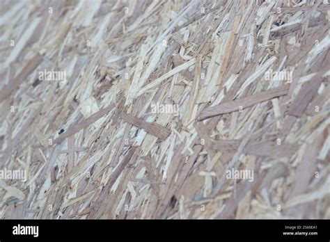 Osb Boards Made Of Brown Wood Chips Sanded Into A Wooden Background
