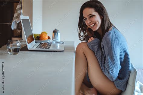 Sexy Girl Smiling While Working On Laptop Stock Photo Adobe Stock