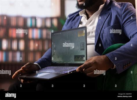 African American Secret Agent Monitoring Satellite Surveillance Data Reviewing Important