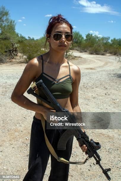 Caucasian Latina Woman With A Russian Ak47 Assault Rifle With American