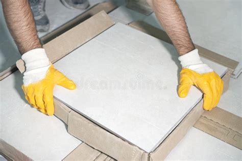 tiler holding a stack of tiles in a pack stock image image of interior tiling 198486865