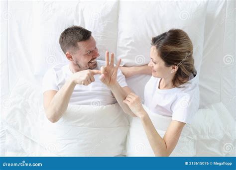 Man Shows Woman Intimate Gestures On Bed Stock Photo Image Of Bedroom