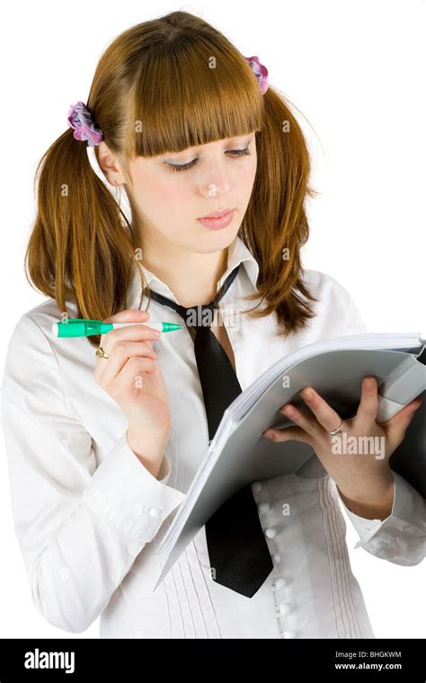 Beautiful Young Blonde Girl Writing In A Notebook Isolated On White