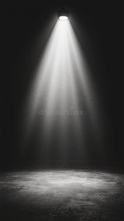 Single Spotlight Illuminating Empty Dark Room With Concrete Floor