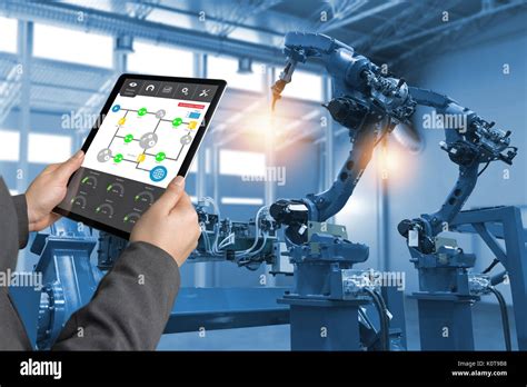 Engineer Hand Using Tablet Heavy Automation Robot Arm Machine In Smart