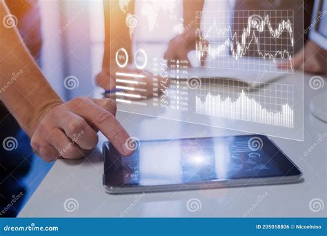 Business Team Analyzing Marketing Sales Financial Metrics On Analytics Report Stock