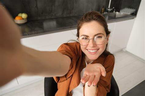 Premium Photo Portrait Of Carefree Young Woman In Glasses Taking