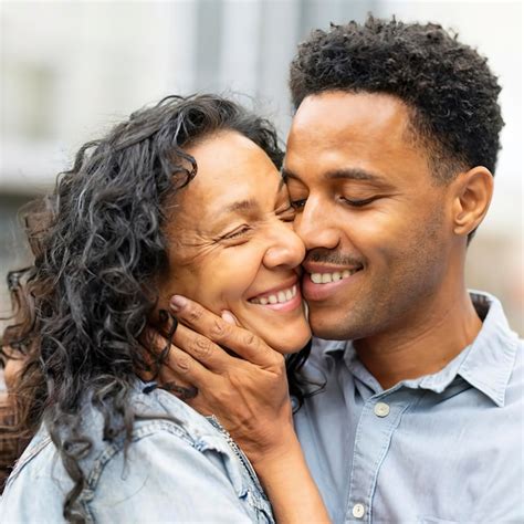 Premium Photo Woman Kissing Happy Husband On Cheek