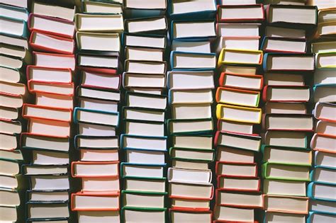 Premium Photo Abundance Of Books Arranged In A Tidy Stack On Table