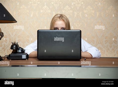 Business Woman Hiding Behind A Laptop Stock Photo Alamy