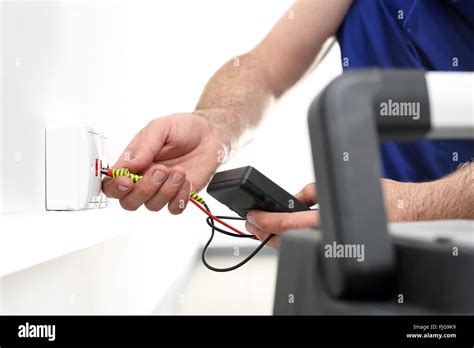 Electrician Installing Internet Installation Of The Wall Socket Man