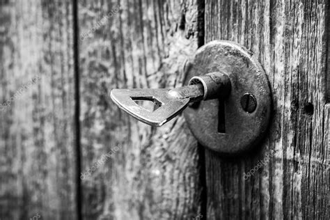 Old Key In A Rusted Door Lock Stock Photo REDPIXEL
