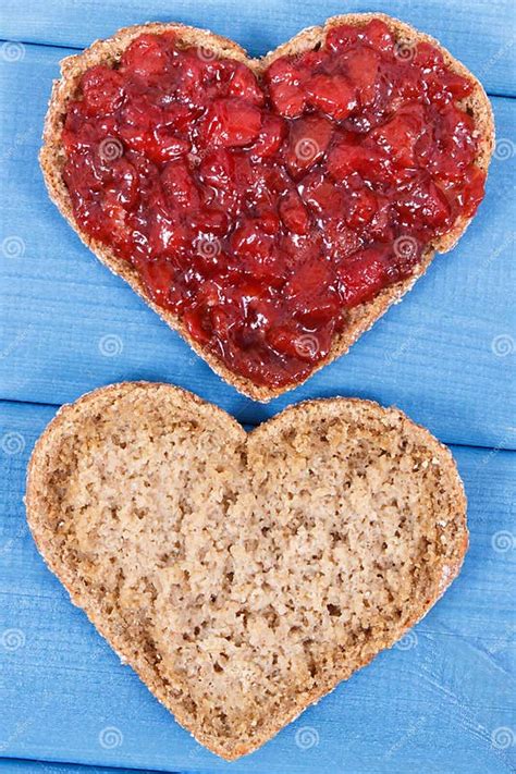 Bread In Shape Of Heart With Strawberry Jam For Breakfast Blue Boards