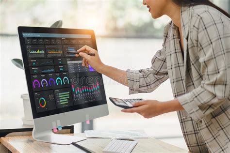 Professional Data Analyst Using Data Visualizations Dashboard On Computer Monitor For Data
