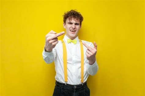 Premium Photo Angry Guy In Festive Outfit Shows The Middle Finger Nerd Babe In Shirt With