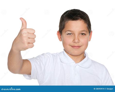 Мальчик Preteen в белой рубашке держит его большой палец руки вверх Стоковое Фото изображение