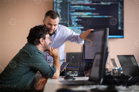Programmers Engrossed In Deep Collaboration Diligently Working