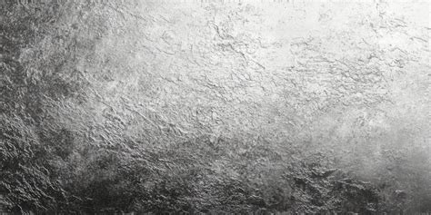Abstract Background With A Grainy Metallic Silver Texture Transitioning From Bright Platinum To