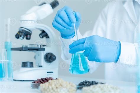 Scientist Analyze Biochemical Samples In Advanced Scientific Laboratory Medical Are Mixing