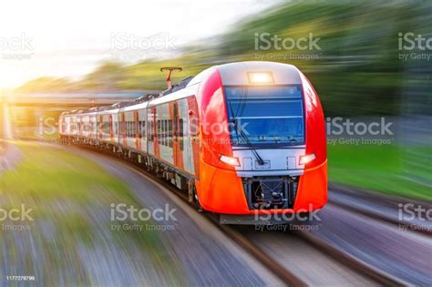 Passenger Electric Train Rides At High Speed On The Turn Of The Railway