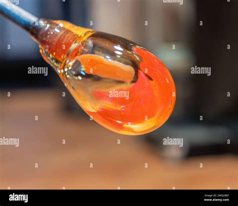 Glassblowing Molten Glass On Edge Of Pontil Manual Process Of Glass Blowing And Forming A