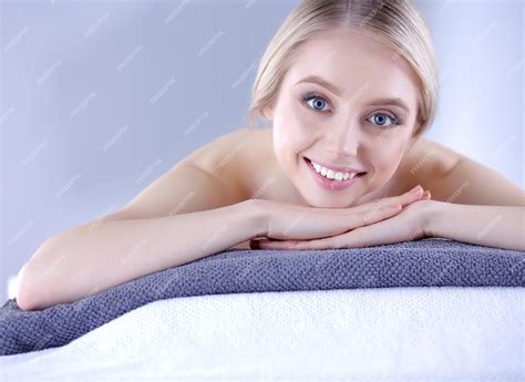 Premium Photo Young Woman Lying On A Massage Tablerelaxing Woman Spa Salon