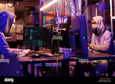 Two Hackers Planning Phishing Cyberattack While Coding Ransomware On